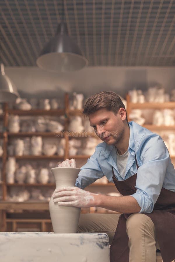 Young man in pottery stock image. Image of hobbies, working - 117302381