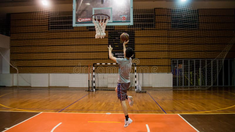 Young Man Practicing Basketball Alone in Arena Editorial Photography ...