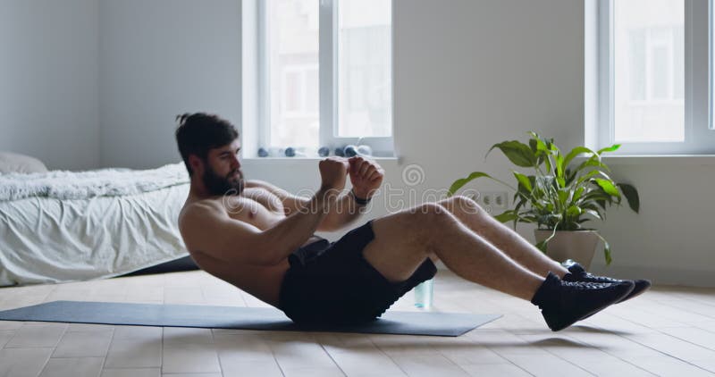 Young Man Practicing Crunches, Training Abdominal Muscles Stock Footage ...