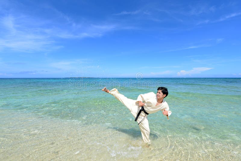 Young Man Practicing Karate at Beach Stock Image - Image of ocean ...