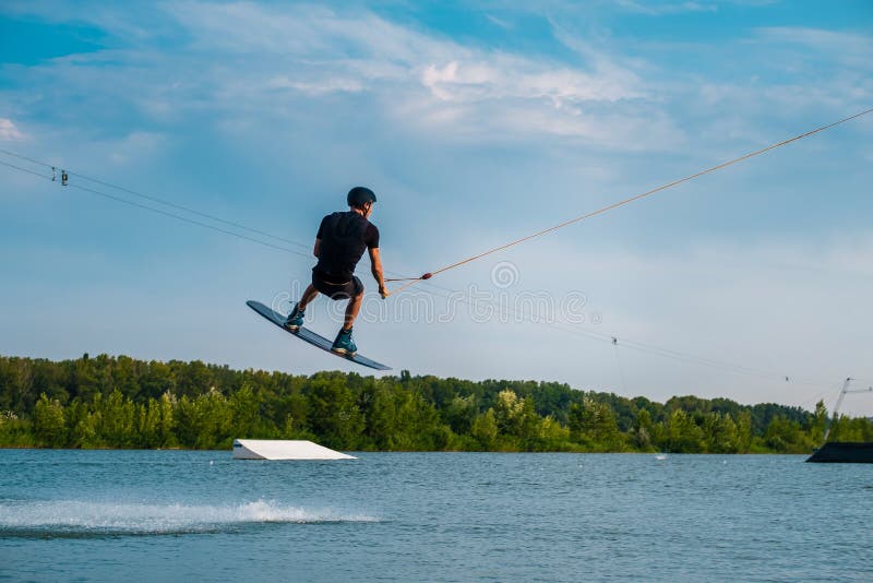 Man Practicing Technique of Jumping during Wakeboarding Training Stock ...