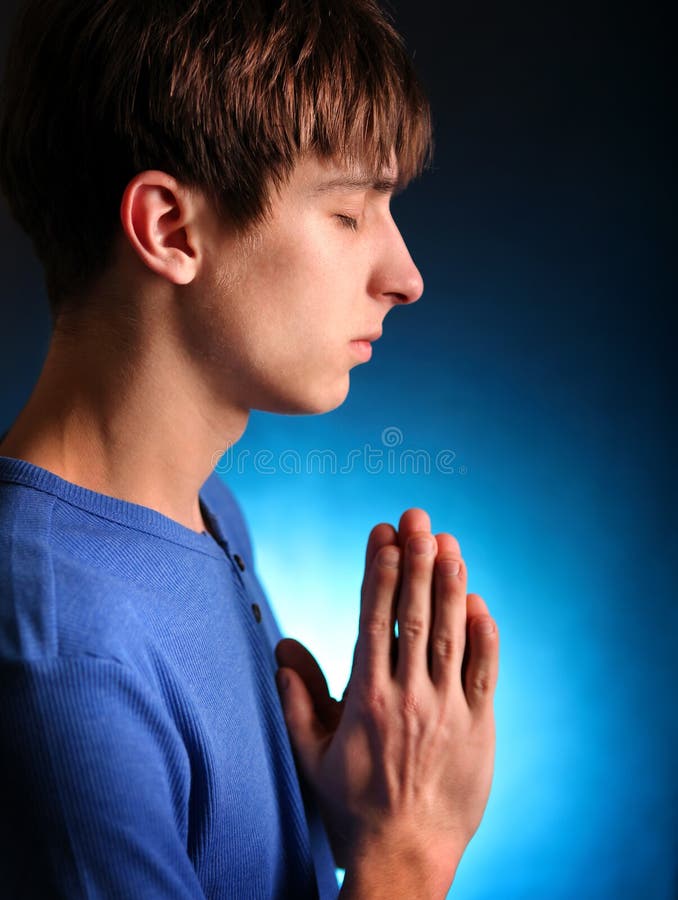 Young Man praying stock photo. Image of portrait, religion - 184196862