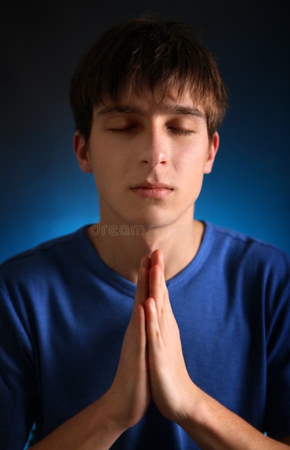 Young Man praying stock image. Image of lifestyle, face - 54545235