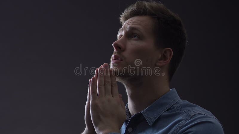 Young Man Praying Faithfully, Looking for Solution To Difficult Life ...