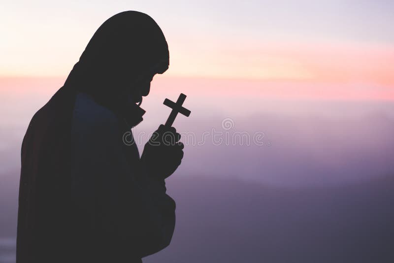 Young Man Praying with the Holy Cross in the Morning Stock Image ...