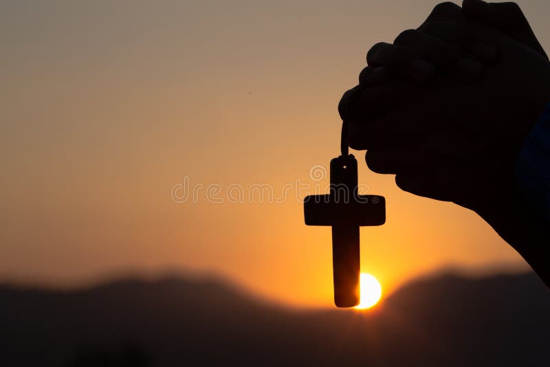 Young Man Praying with the Holy Cross in the Morning Stock Photo ...