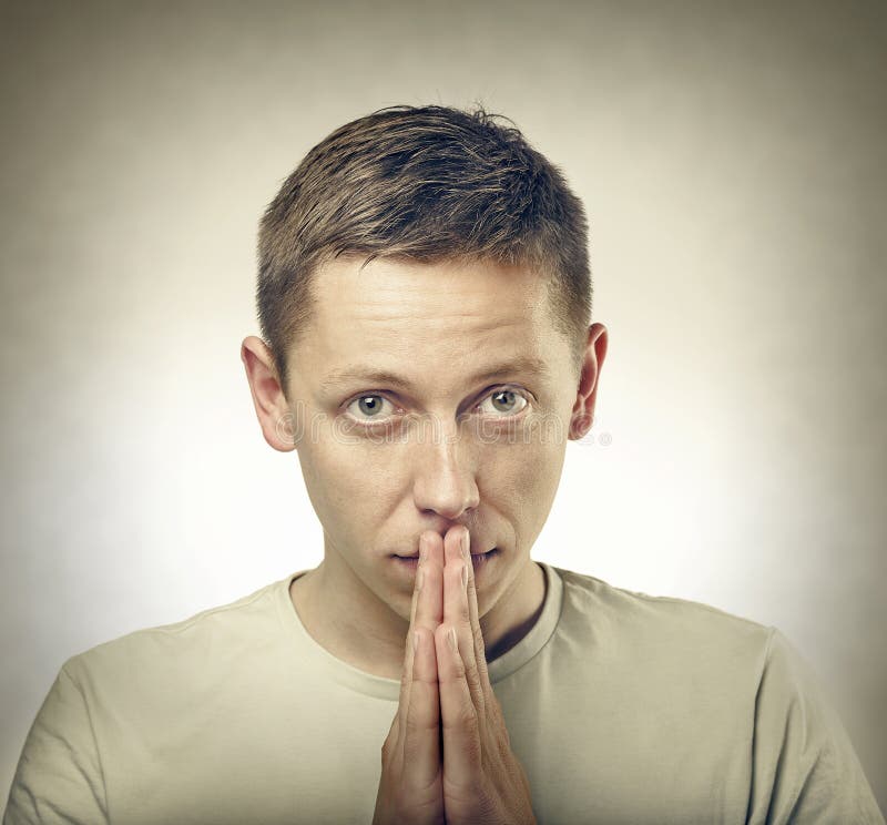 Young Man Praying or Thinking Stock Photo - Image of emotional, blond ...