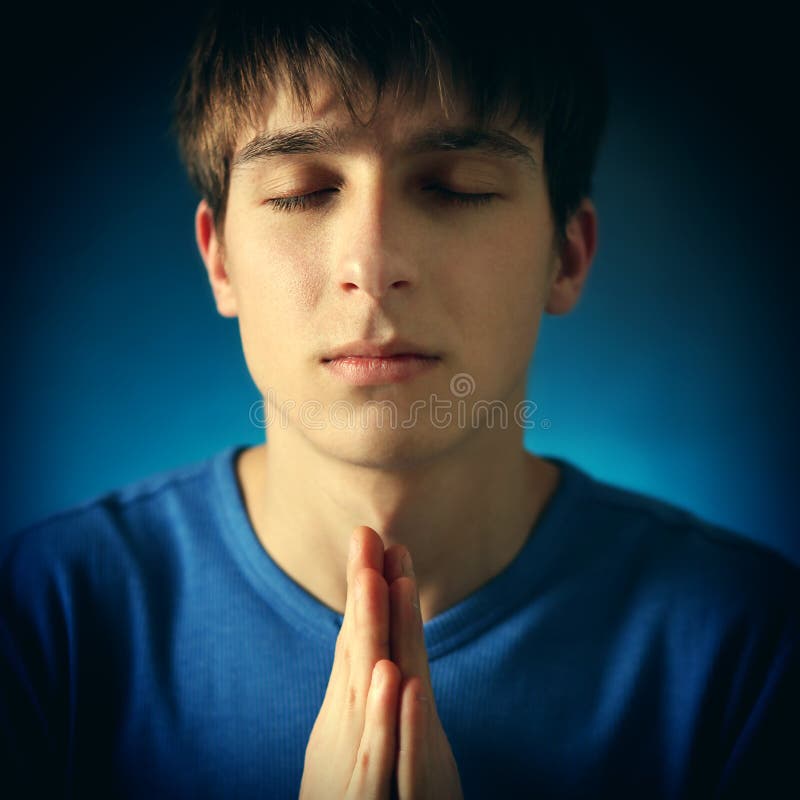 Young Man praying stock image. Image of face, adult - 239988777