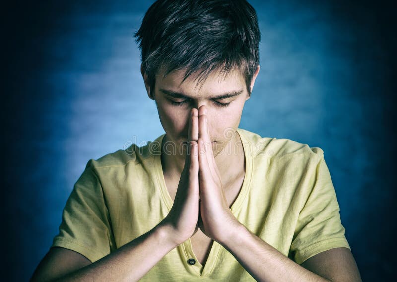 Young Man praying stock photo. Image of quiet, prayer - 78202418