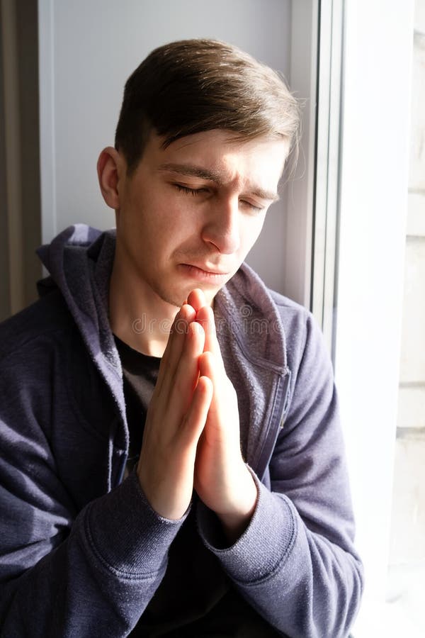 Young Man praying stock image. Image of human, home - 214313365