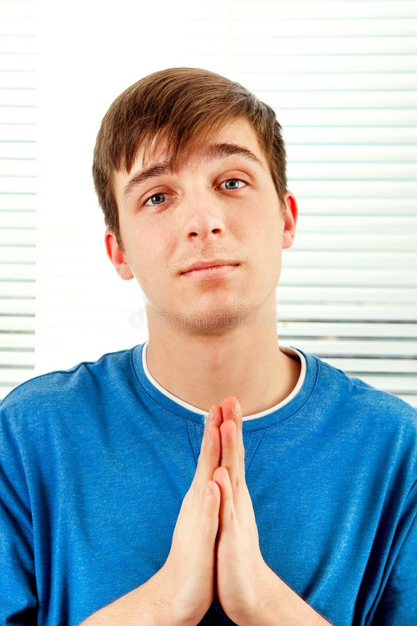 Young Man praying stock image. Image of indoor, home - 210478543