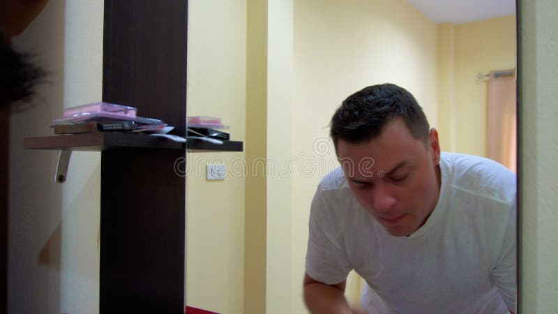 Young Man Preen Himself Infront of the Mirror Stock Footage - Video of ...