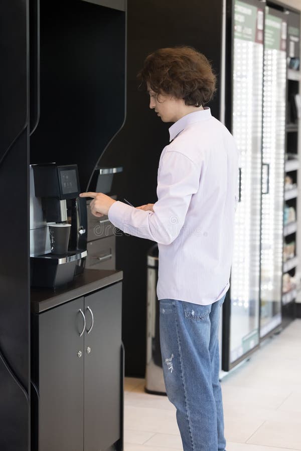 Young Man Prepare Coffee Using Professional Vending Machine Stock Image ...
