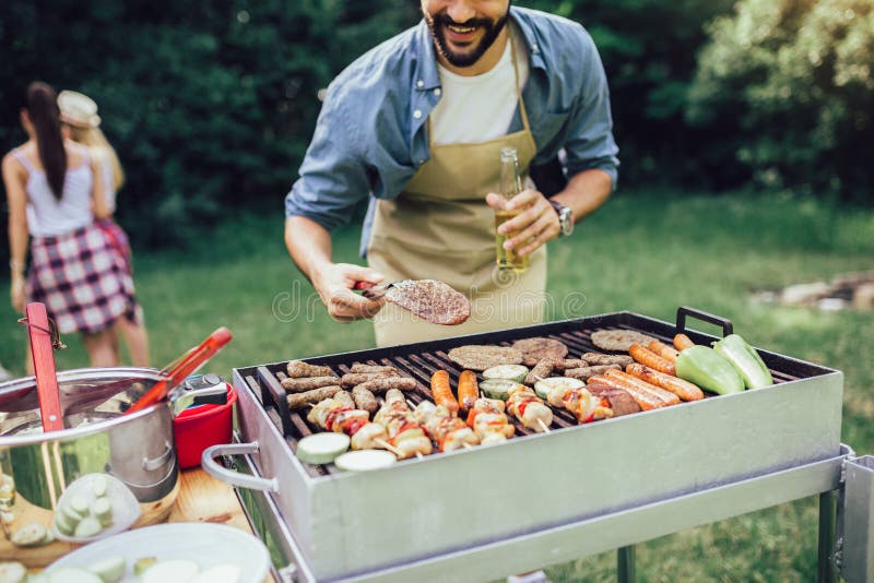 Man Preparing Barbecue for Friends Outdoor Stock Image - Image of ...