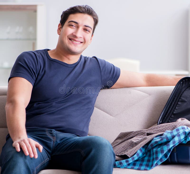 Young Man Preparing Packing for Summer Vacation Stock Photo - Image of ...