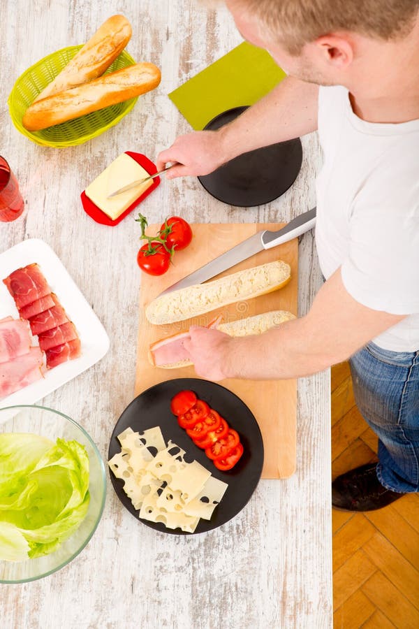 Young Man Preparing a Sandwich Stock Photo - Image of delicious ...
