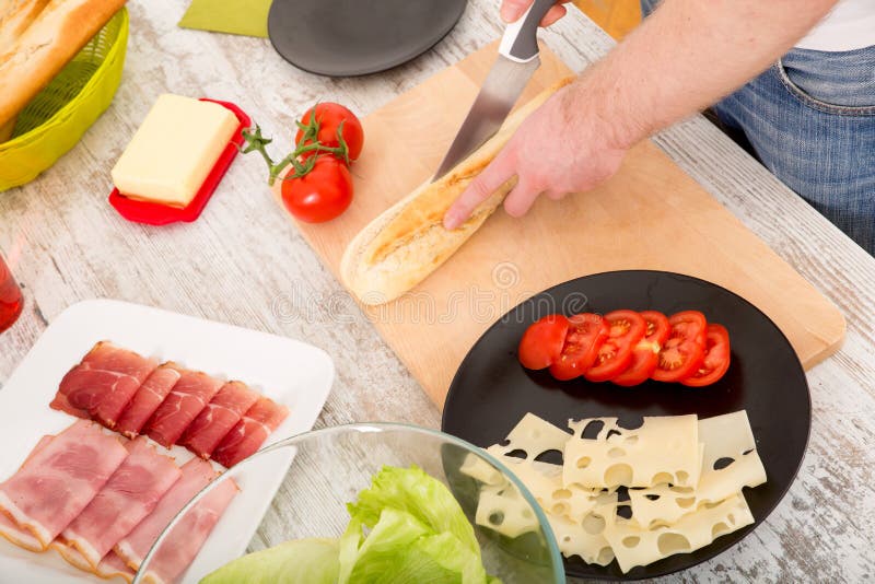 Young Man Preparing a Sandwich Stock Image - Image of bread, culinary ...