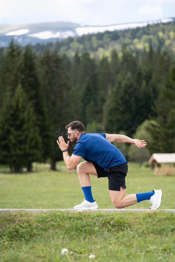 Young Man Preparing for a Sprint Stock Image - Image of path, shirt ...