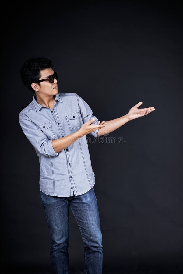 Young Man Presenting and Showing Your Text or Product Stock Photo ...