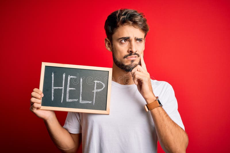 Young Man with Problem Holding Blackboard with Help Message Over Red ...