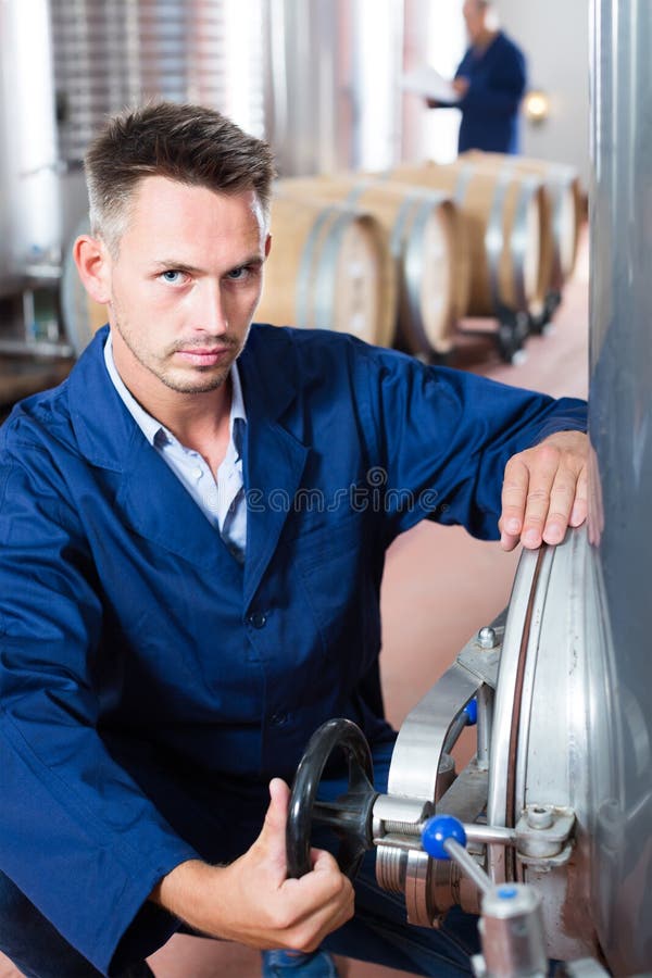 Young Man Professional Machinery Operator Working in Winery Stock Photo ...