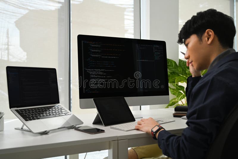 Young Man Programmer Working On Computer To Check Coding In Bugging System In It Office Stock 3904
