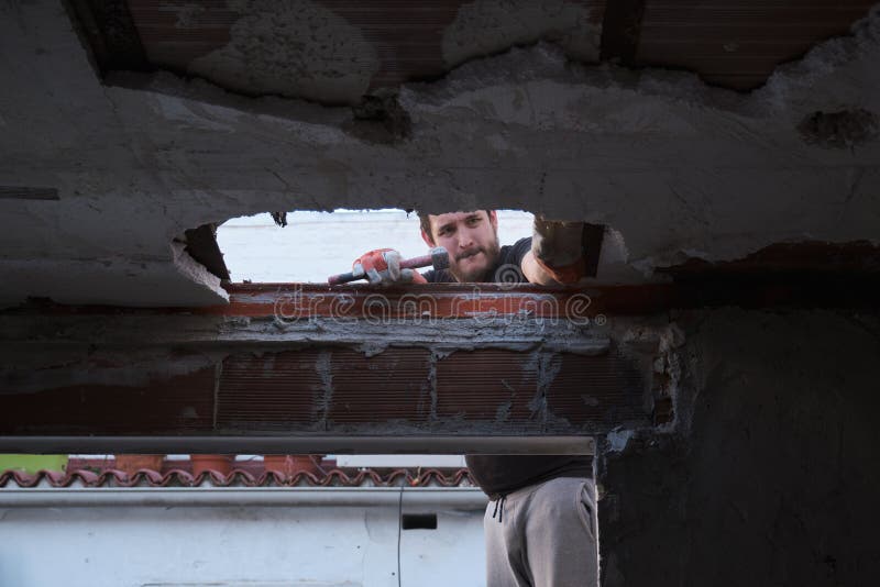 Young Man Pulling the Ceiling of a House Down. Stock Photo - Image of ...