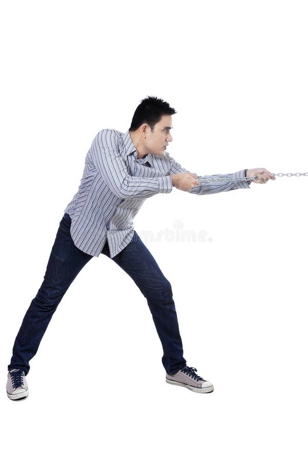 Young man pulling a chain stock image. Image of help - 34086843