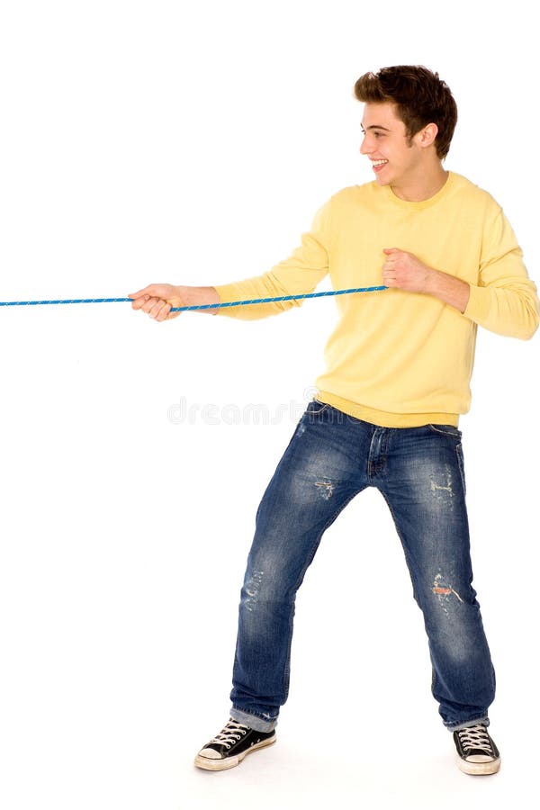 Young man pulling a rope stock image. Image of shot, background - 20085663