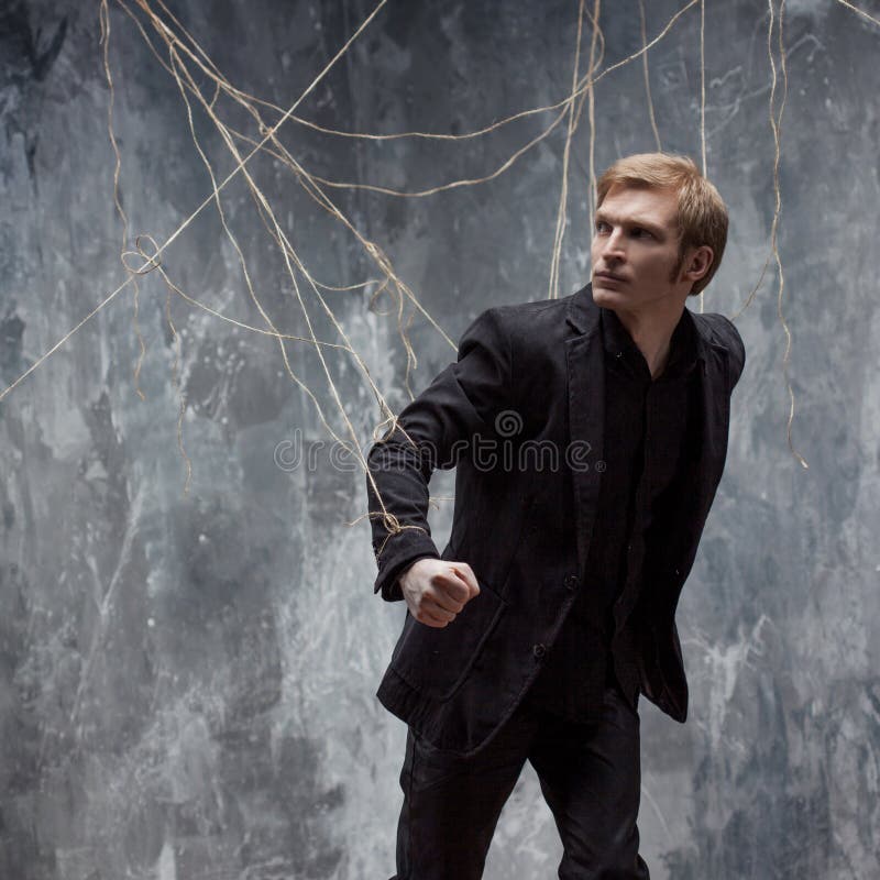 Young Man Pulling Something Behind Him. Concept of Manipulation and ...