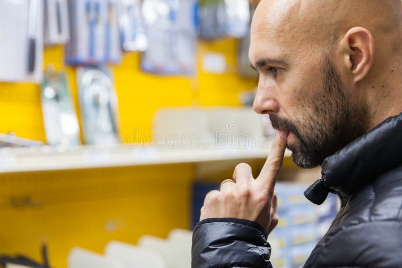 Young Man Purchasing a Hand Tool in Hardware Shop Stock Photo - Image ...