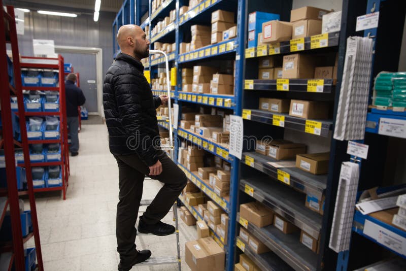 Young Man Purchasing a Hand Tool in Hardware Shop Stock Photo - Image ...
