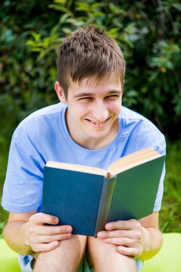 Young Man read a Book stock image. Image of reading - 140394611