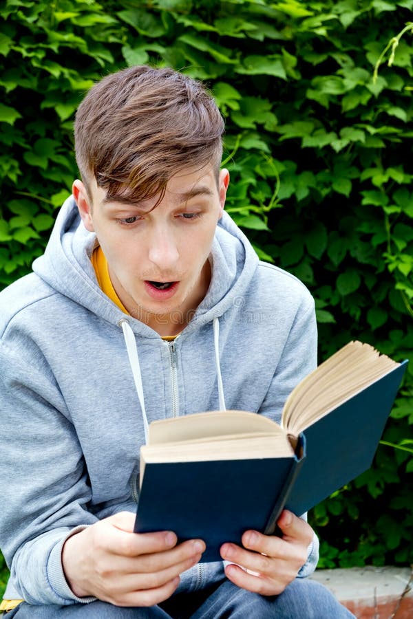 Young Man read a Book stock photo. Image of pages, dazed - 237609276