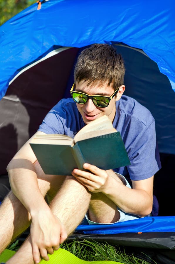 Young Man read a Book stock image. Image of reading - 148499831