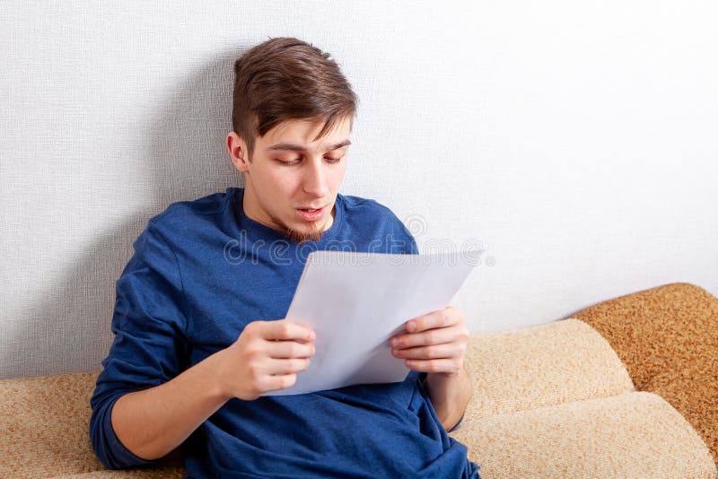 Young Man read a Document stock photo. Image of contract - 175917886