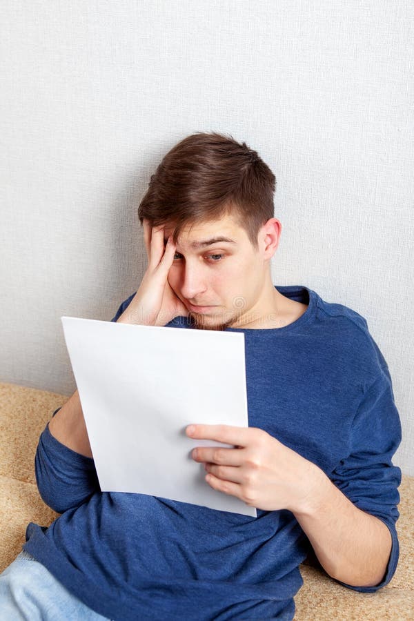 Young Man read a Document stock image. Image of finance - 175917915