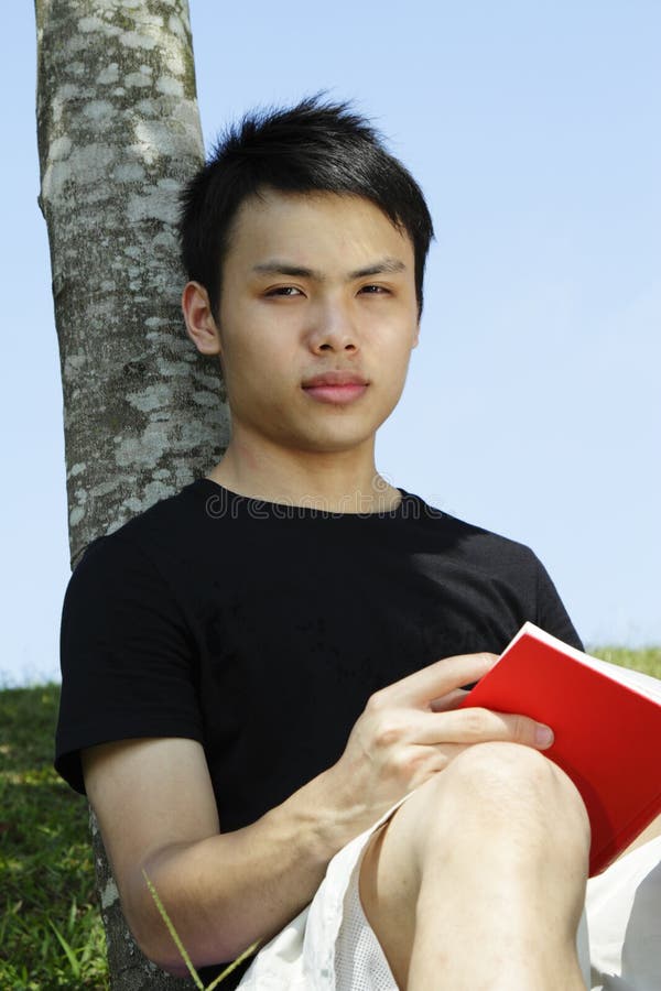 Young Man Reading stock photo. Image of read, wear, young - 13519496