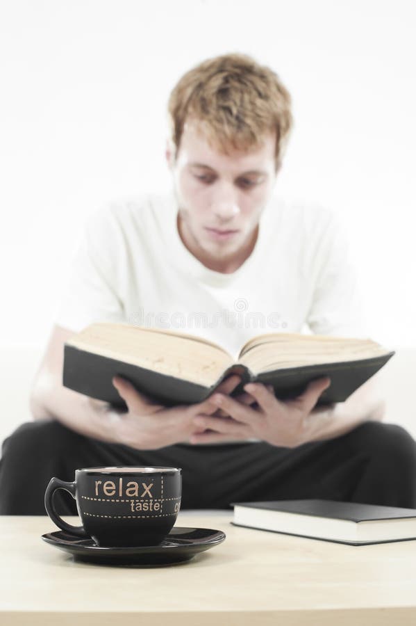 Young man reading stock photo. Image of living, adult - 17918554