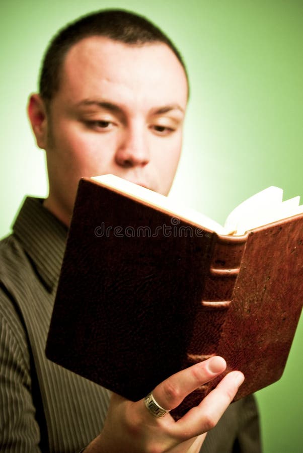 Young man reading stock image. Image of concentrating - 3521887