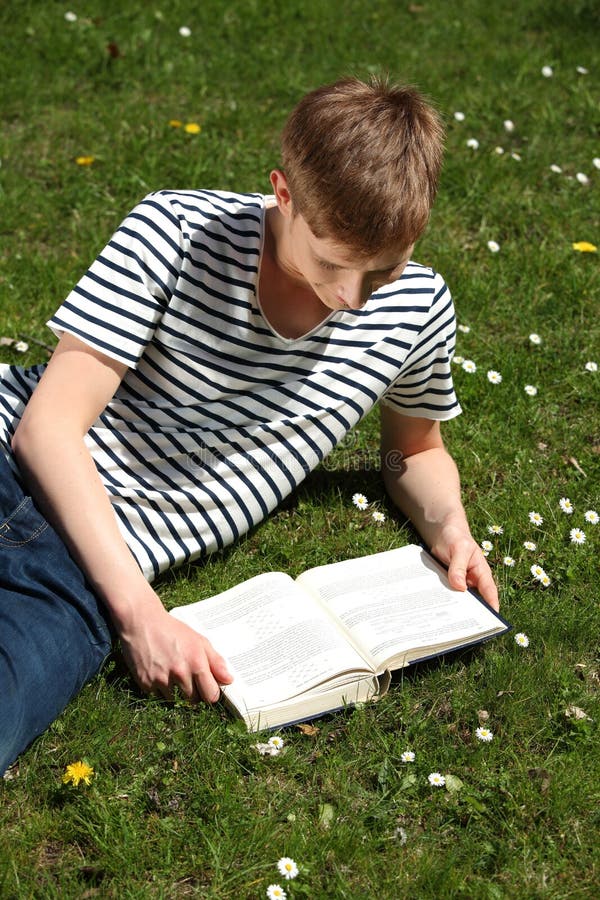 Young man reading book stock photo. Image of lifestyles - 19679912