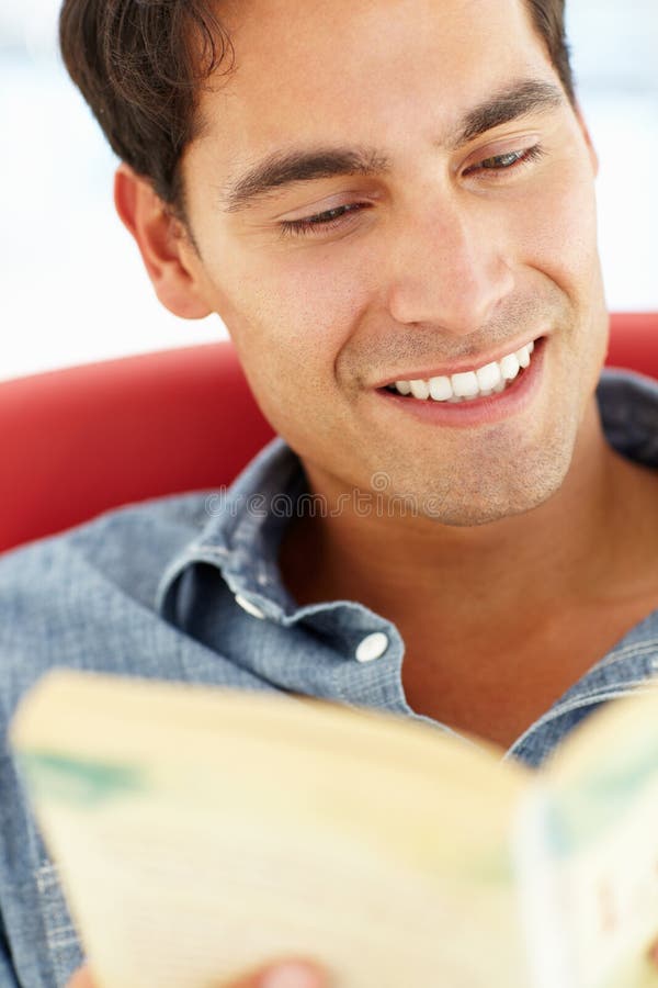 Young man reading a book stock image. Image of reading - 21289193