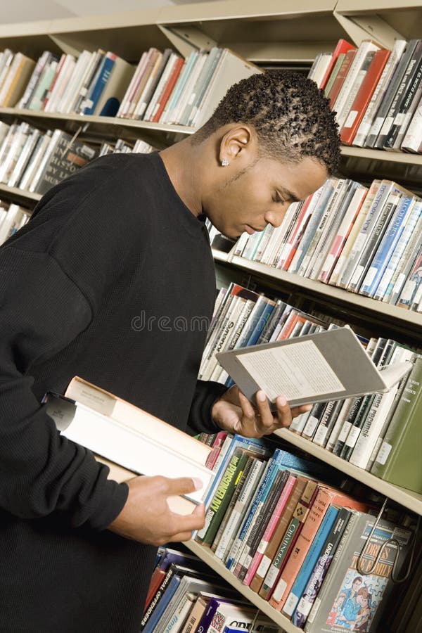 Young Man Reading Book stock image. Image of research - 29648705