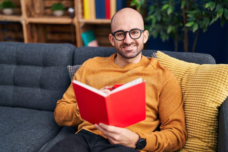 Young Man Reading Book and Drinking Coffee at Home Stock Photo - Image ...