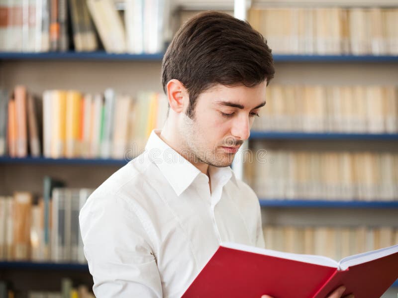 Young man reading a book stock image. Image of indoor - 42043771