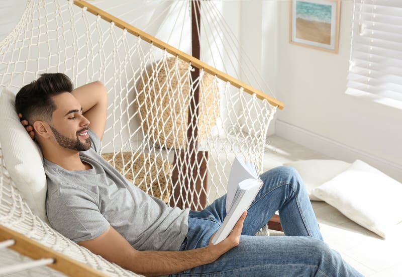 Young Man Reading Book in Hammock Stock Image - Image of comfort, happy ...