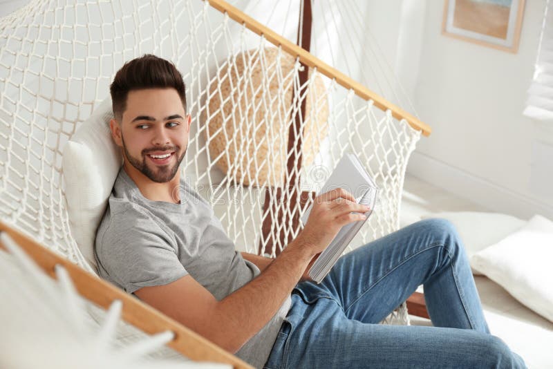 Young Man Reading Book in Hammock Stock Image - Image of modern ...
