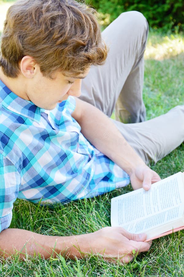 Young Man is Reading a Book Stock Photo - Image of serious, ideas: 58648922