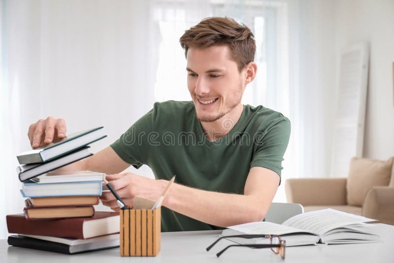 Young Man Reading Books at Home Stock Image - Image of learning, adult ...