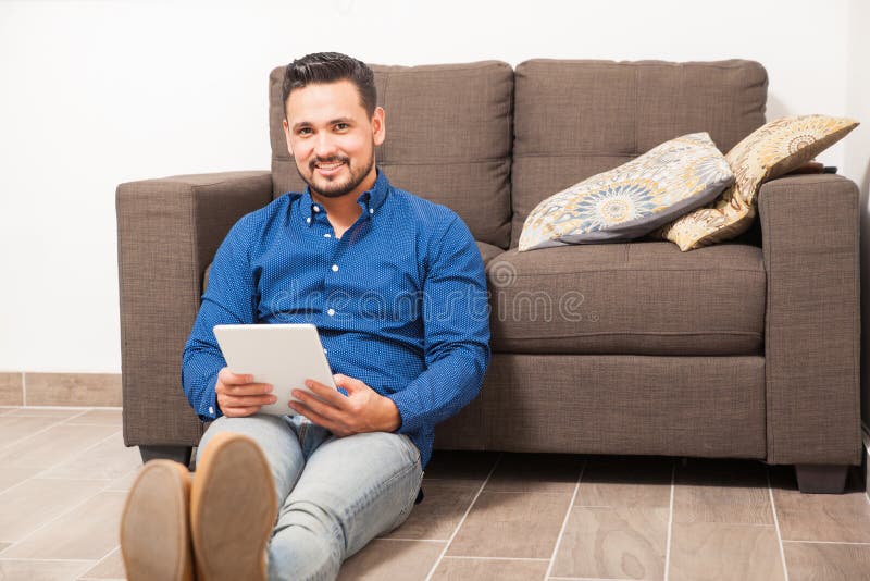 Young Man Reading on a Tablet Computer Stock Image - Image of smile ...